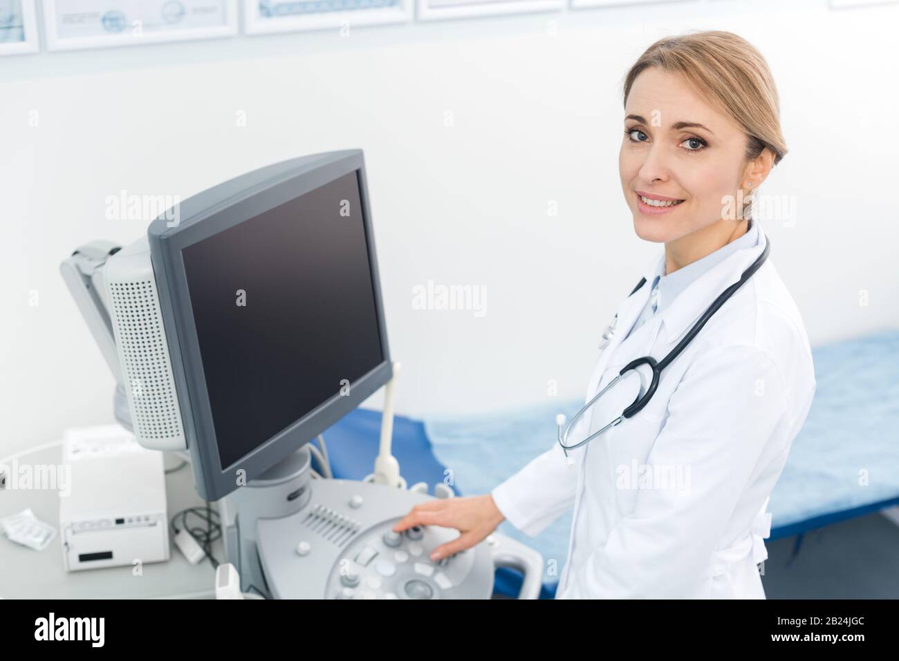 beautiful professional doctor working with ultrasound scanner with ...