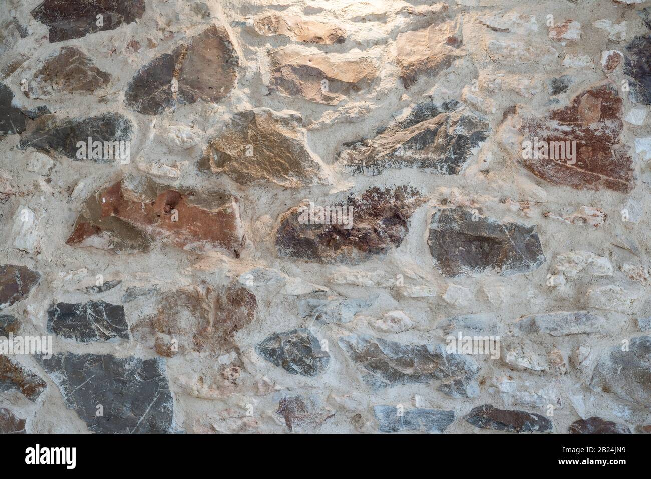 The wall background is made of stone, highlighted from above Stock ...