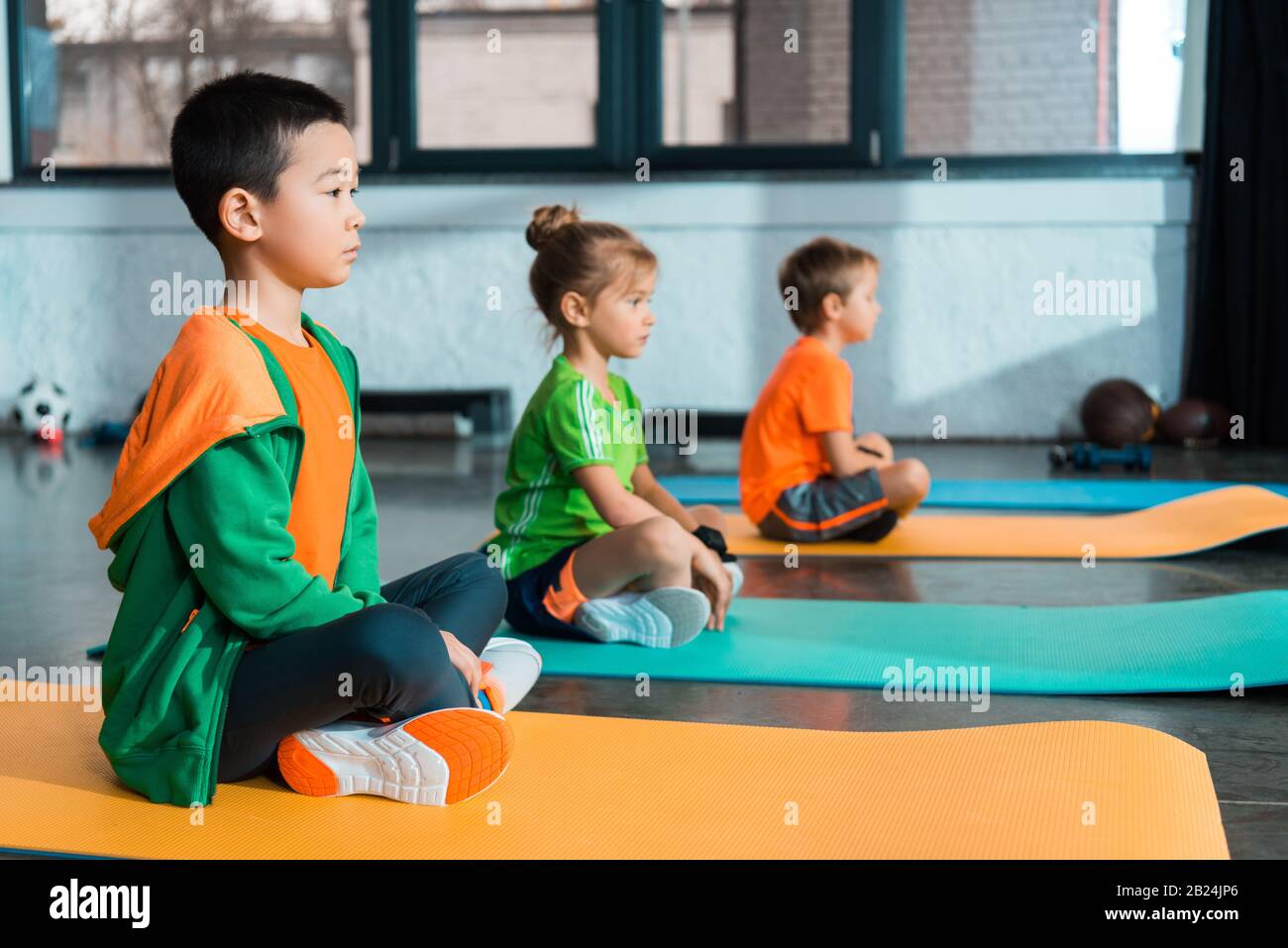 Kids sitting legs sneakers hi-res stock photography and images - Alamy
