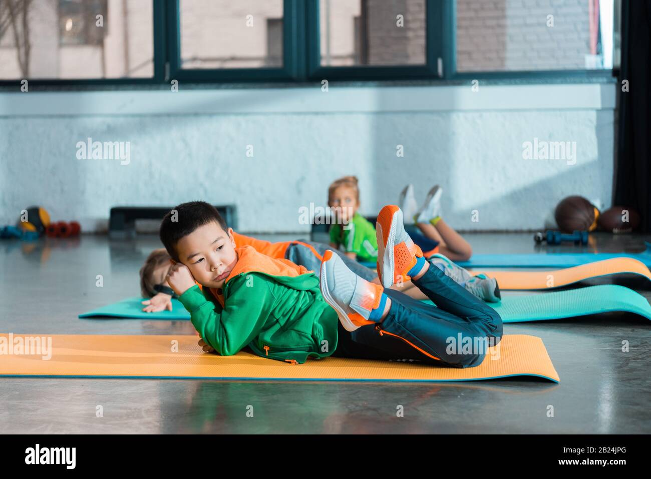 Fitness class lying on mats hi-res stock photography and images - Alamy
