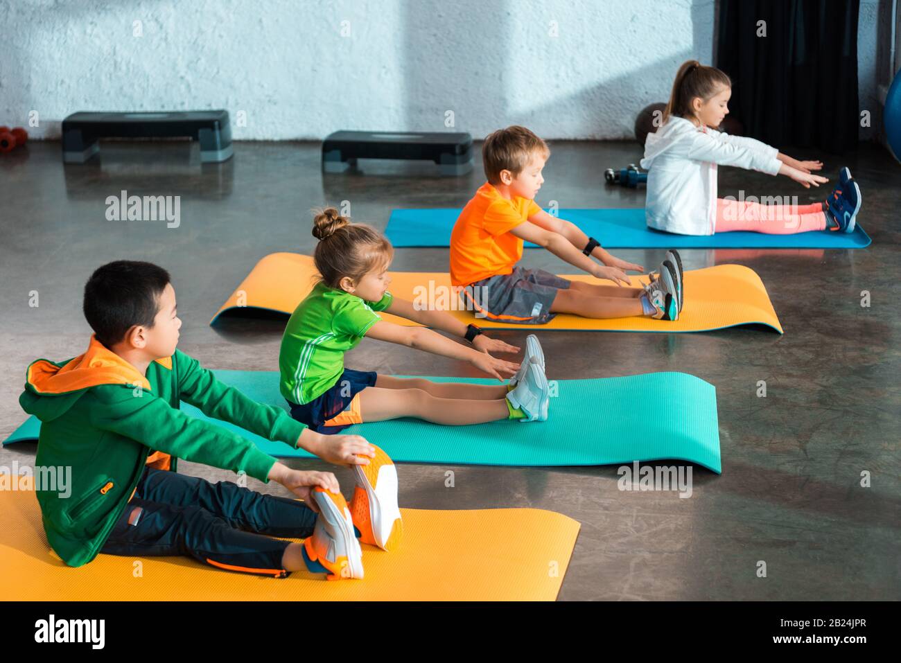Children stretching hi-res stock photography and images - Alamy