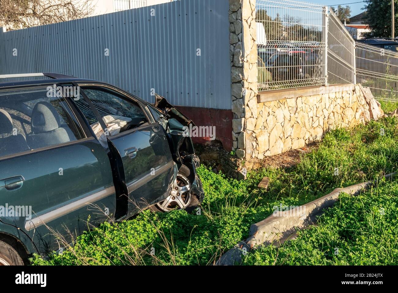 The car crashed into the wall, looking after the crash. Drunk driver ...