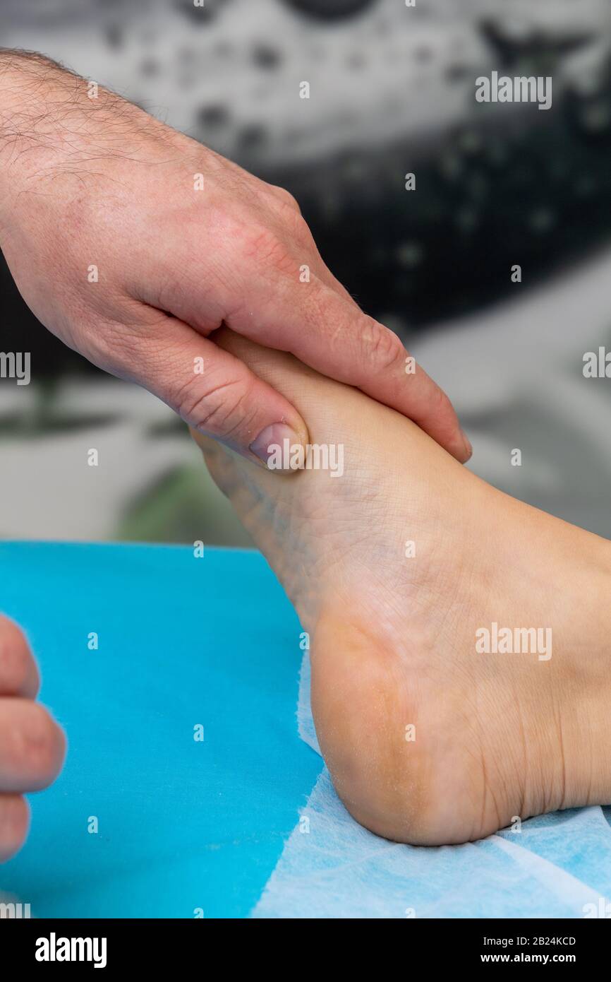 Doctor masseur makes foot hi-res stock photography and images - Alamy