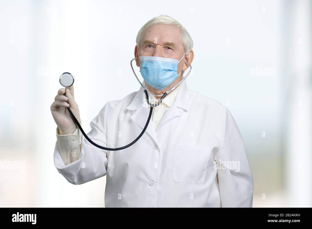 Old doctor hold stethoscope Stock Photo - Alamy