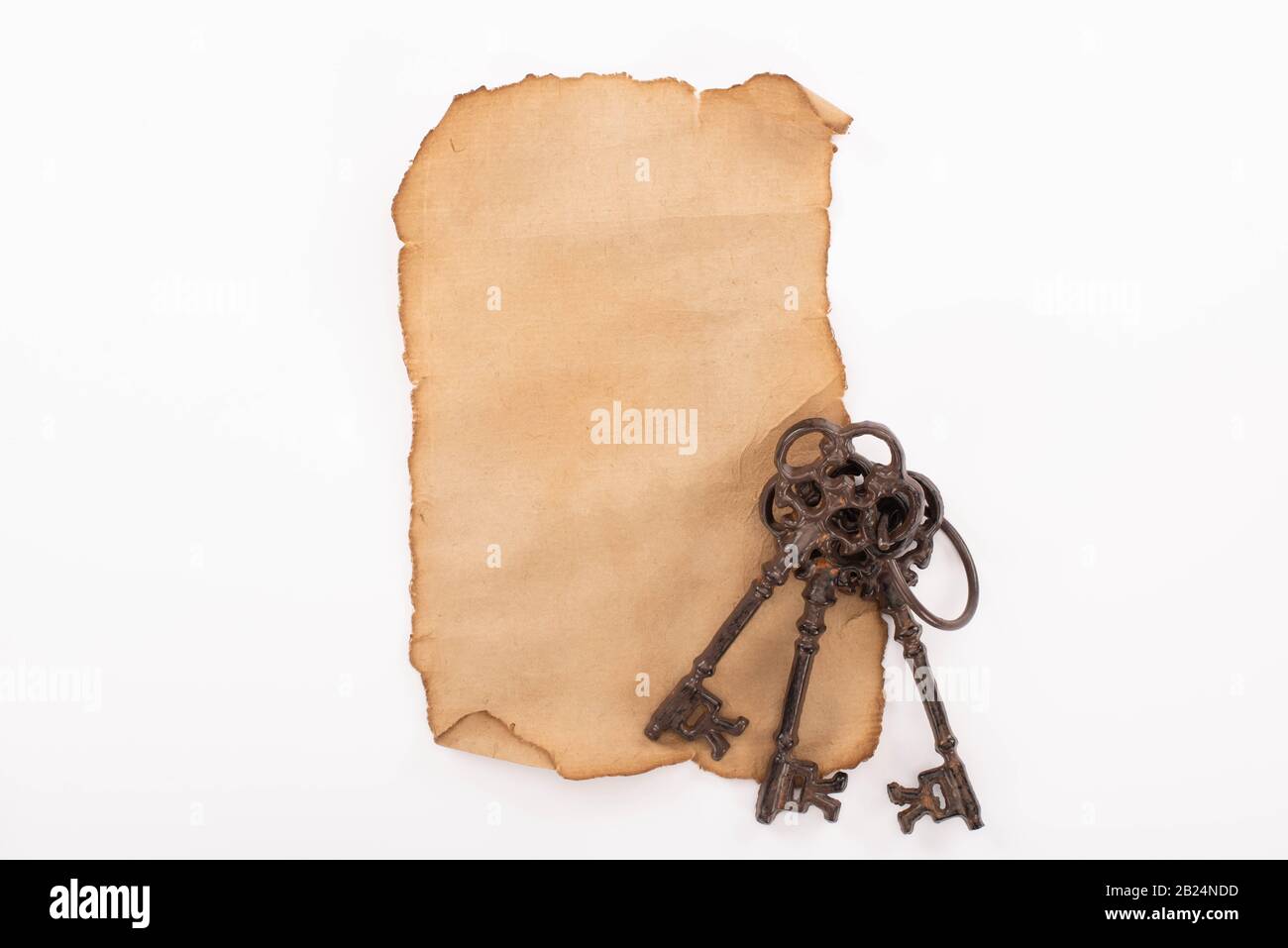 top view of vintage keys on aged empty paper isolated on white Stock ...
