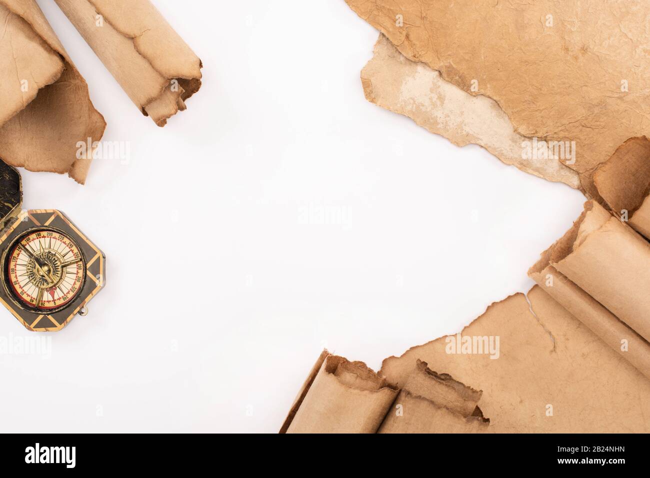 top view of vintage compass and aged paper isolated on white Stock ...