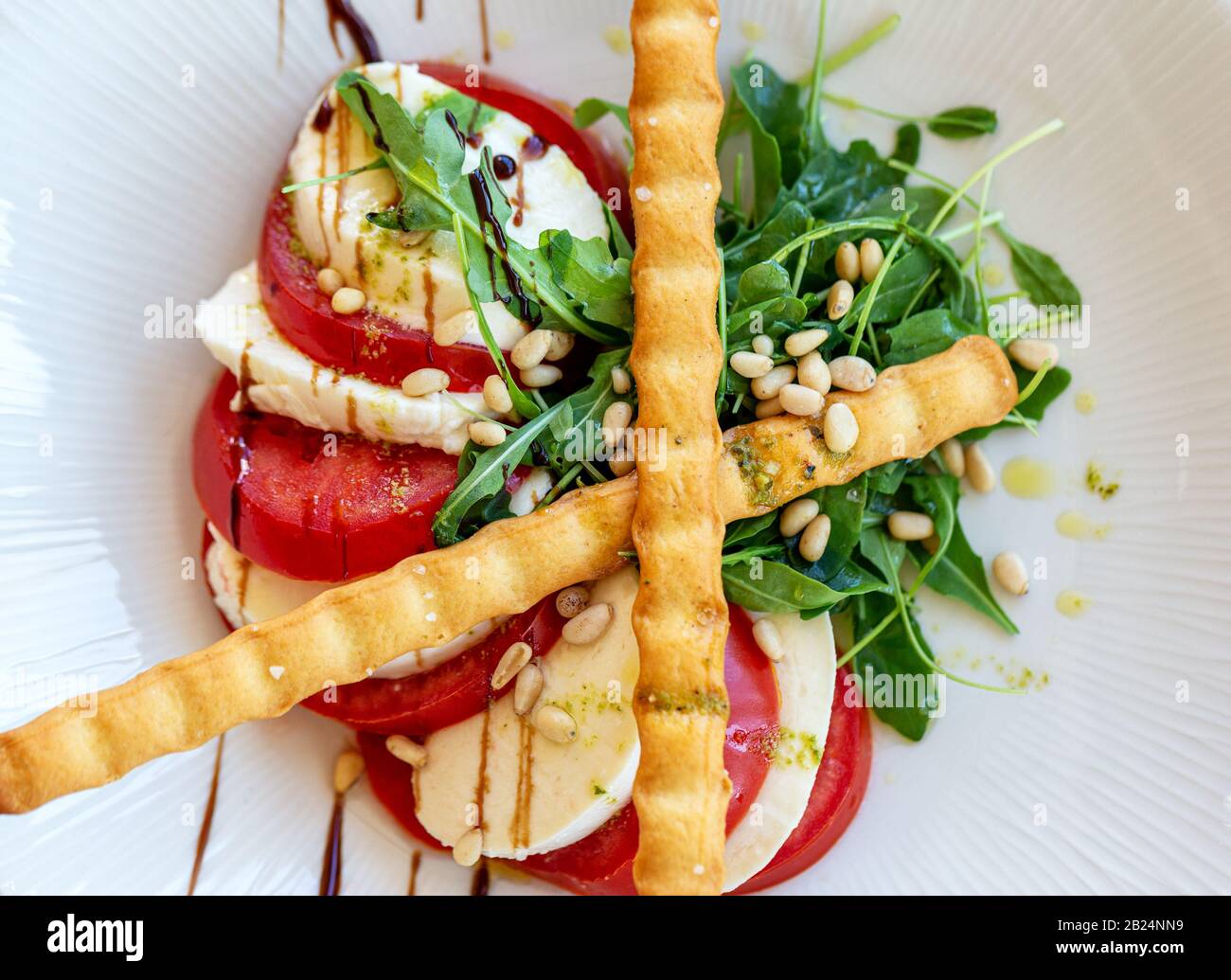 Portuguese salad snack mozarela with tomato and wafer rolls Stock Photo ...
