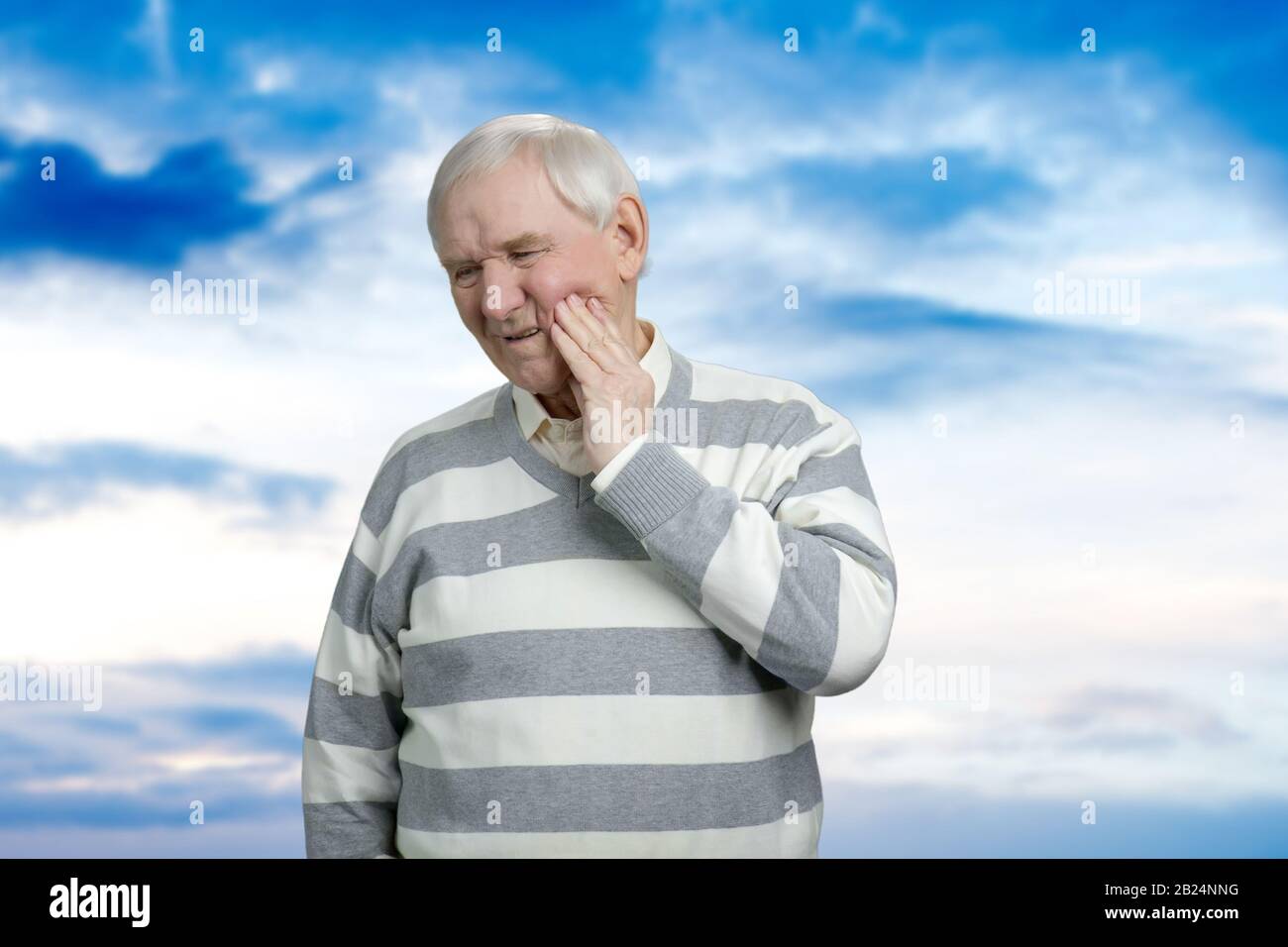 Old grandfather with toothache Stock Photo - Alamy