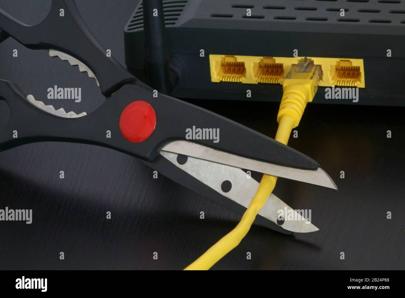 A pair of scissors is shown just before cutting the internet connection ...