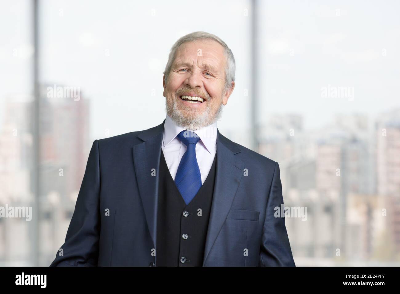 Old cheerful male manager laughing out loud Stock Photo - Alamy
