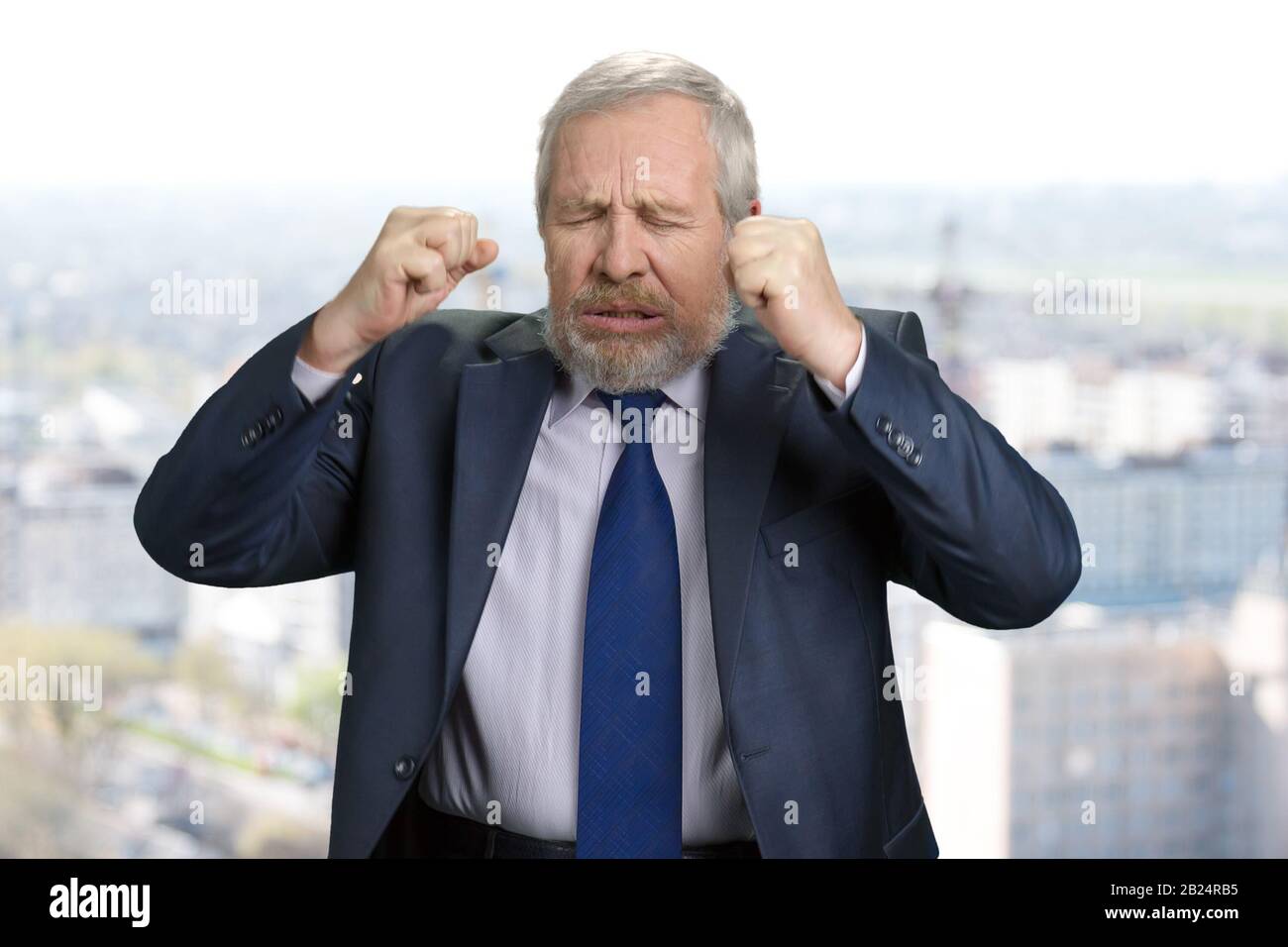 Extremely upset senior business man Stock Photo - Alamy