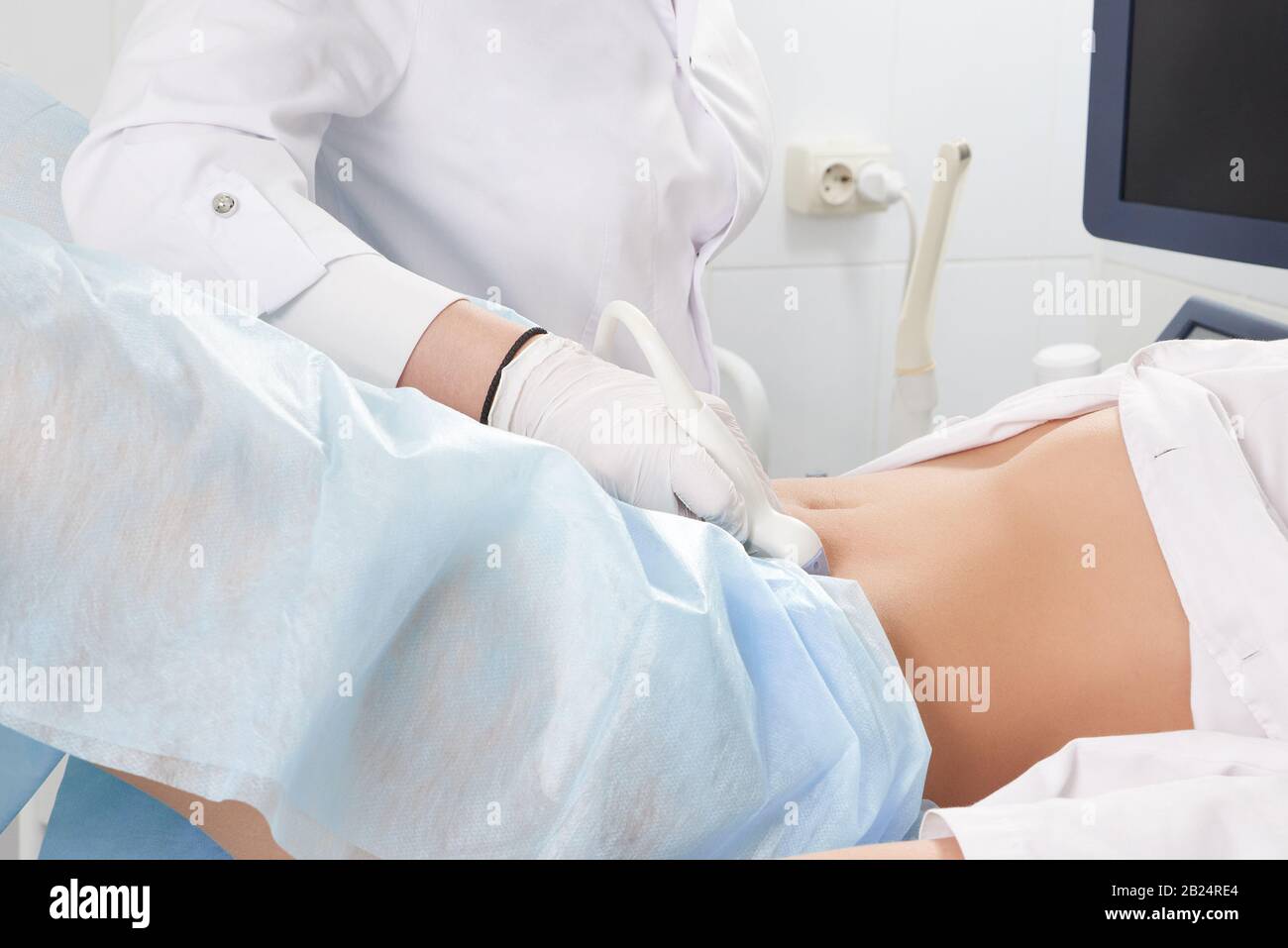 Cropped view of woman at gynecologist's doing ultrasound scan of the ...