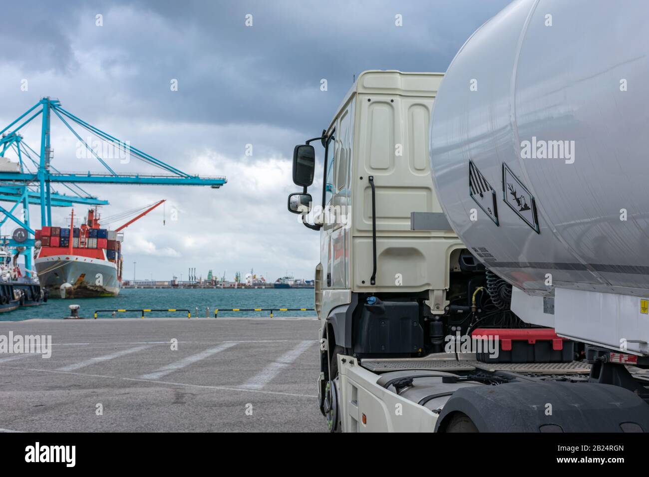 Tanker truck with dangerous goods at the port to supply a ship Stock ...