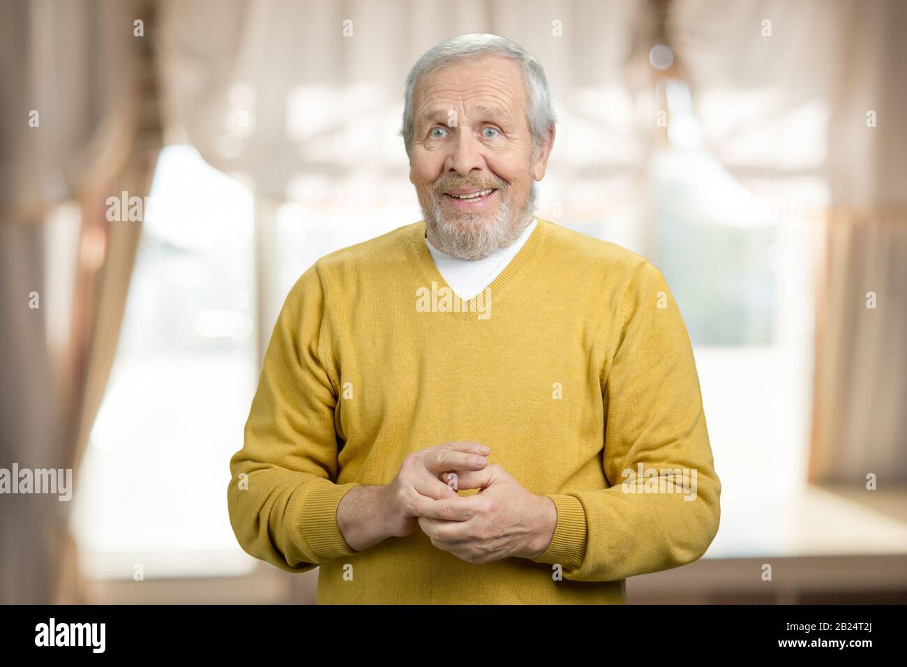 Portrait of excited old man Stock Photo - Alamy