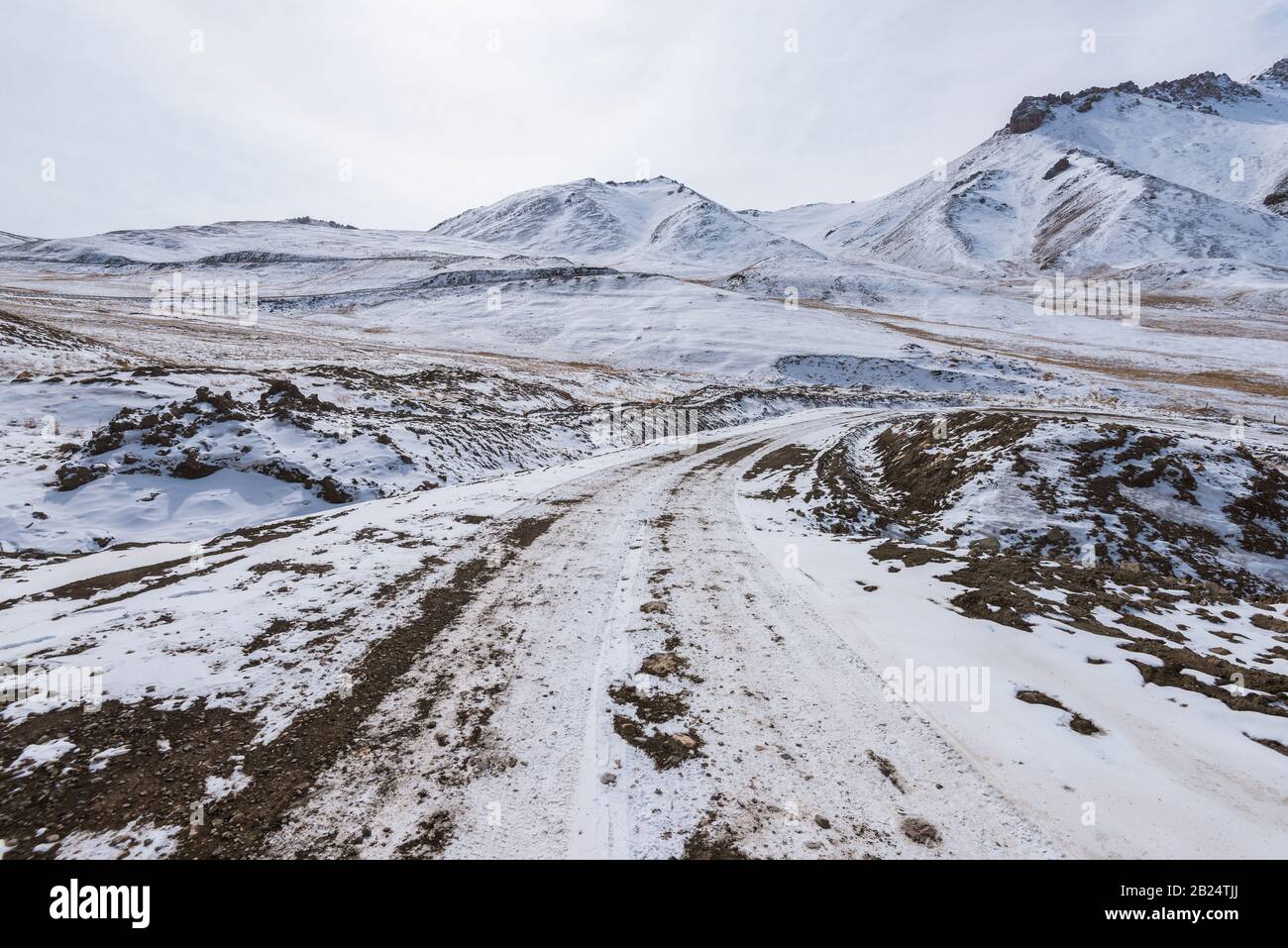 the gravel road on the snow mountain Stock Photo - Alamy