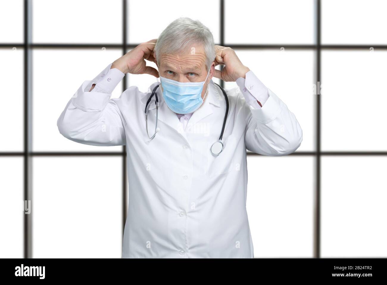 Serious old surgeon face put hi-res stock photography and images - Alamy