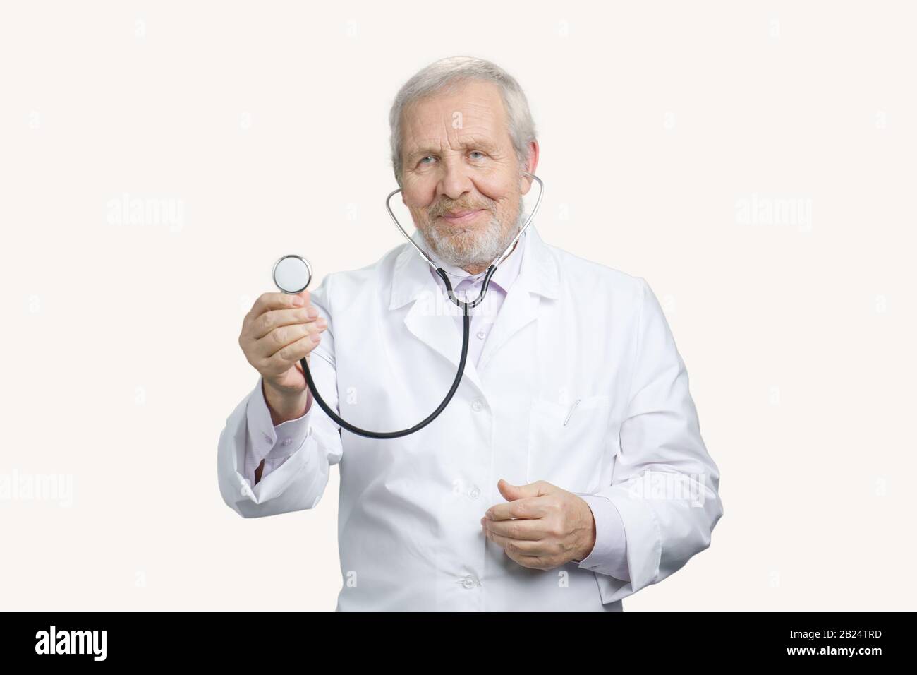 Old doctor using stethoscope Stock Photo - Alamy