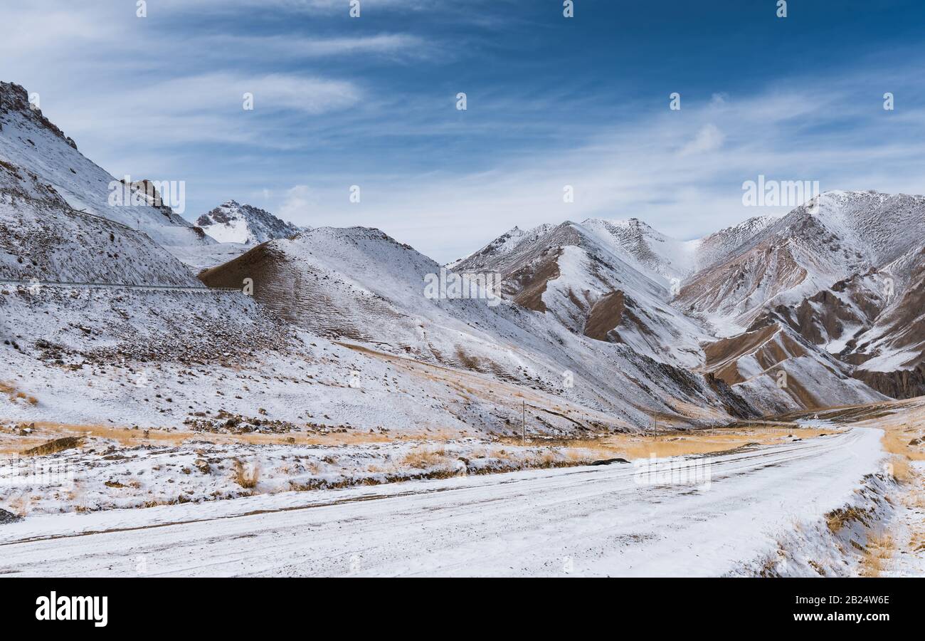 the gravel road on the snow mountain Stock Photo - Alamy