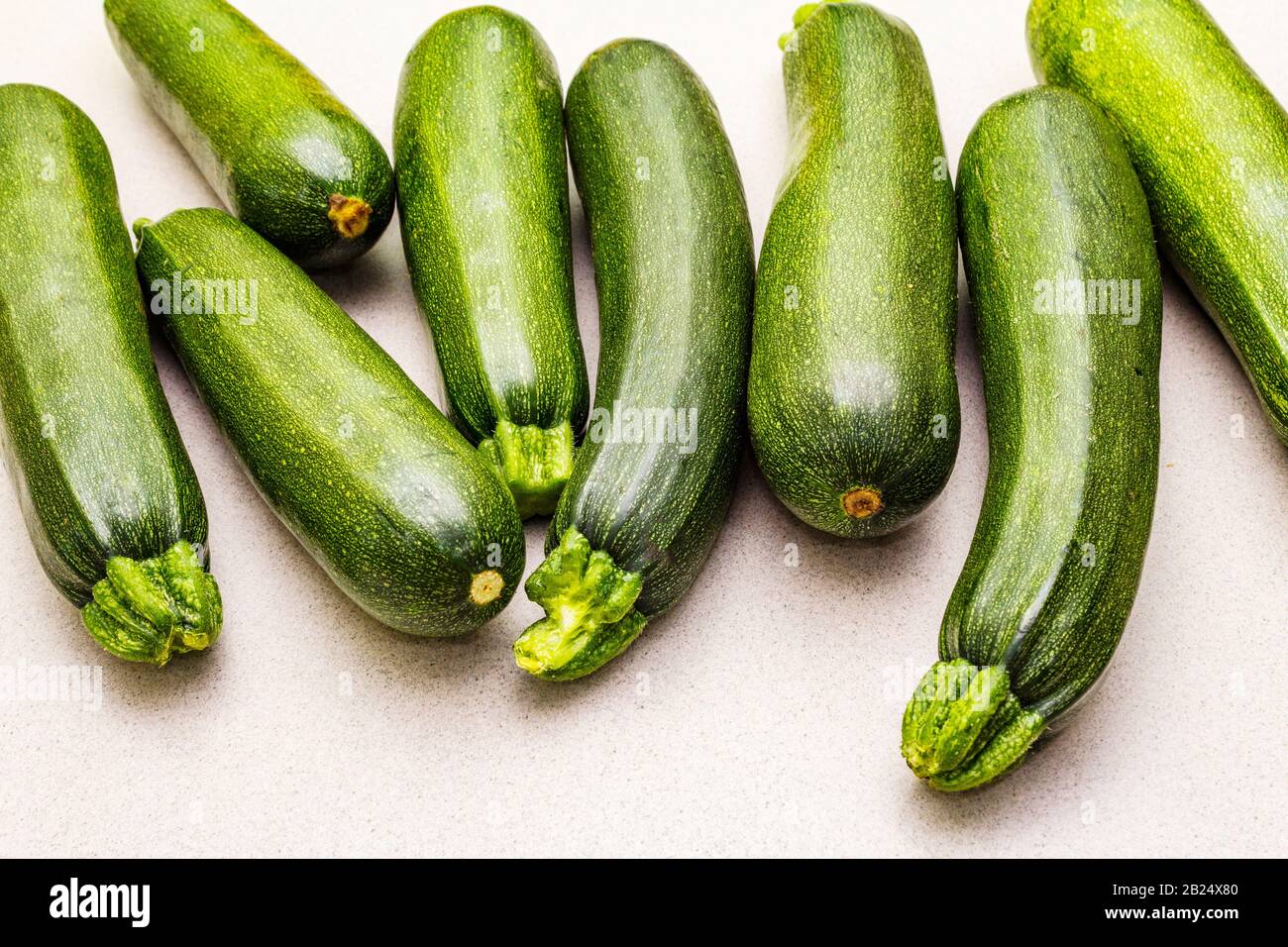 Bright green zucchini. Fresh vegetables for cooking. Harvest on stone ...