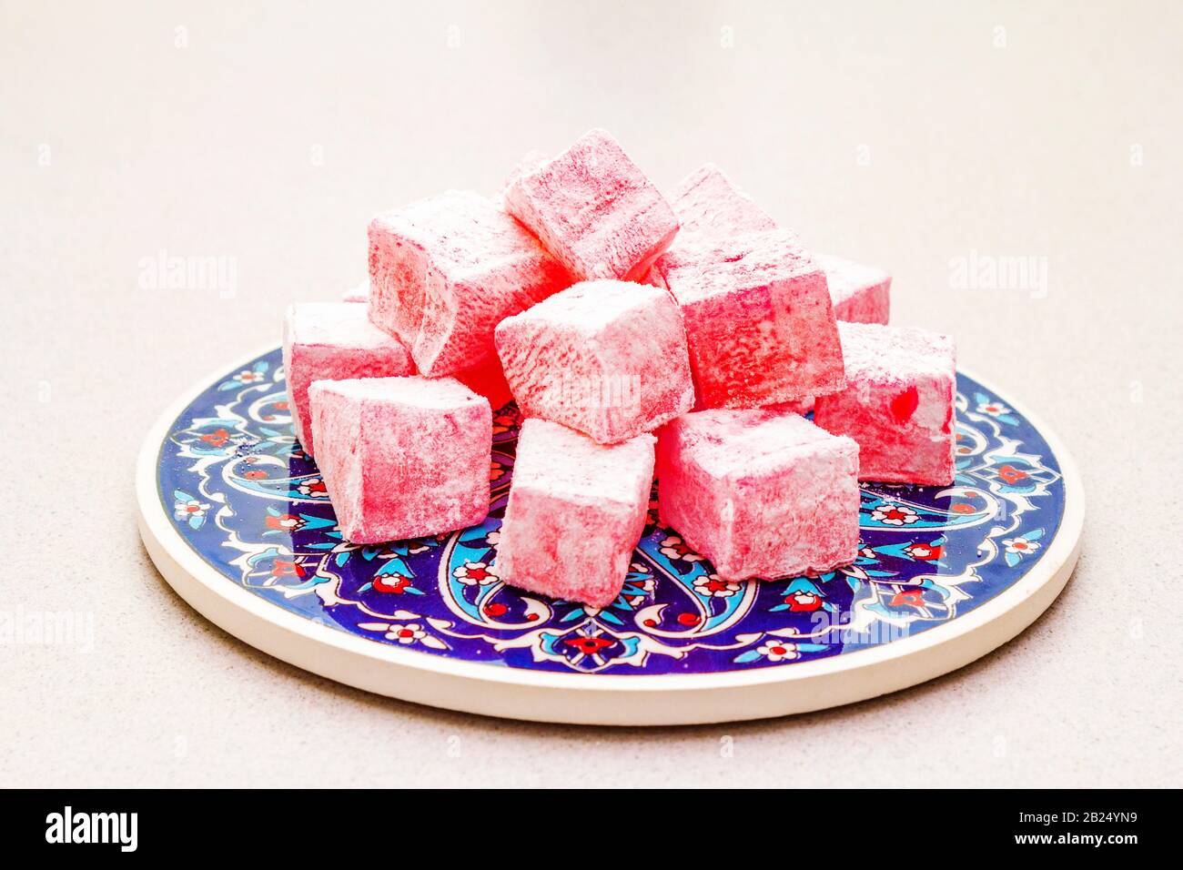 Eastern sweets. Traditional Turkish delight Rahat lukum with a rose on ...