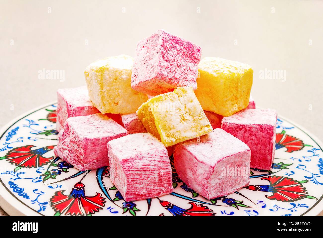 Eastern sweets. Traditional Turkish delight Rahat lukum with a rose and ...