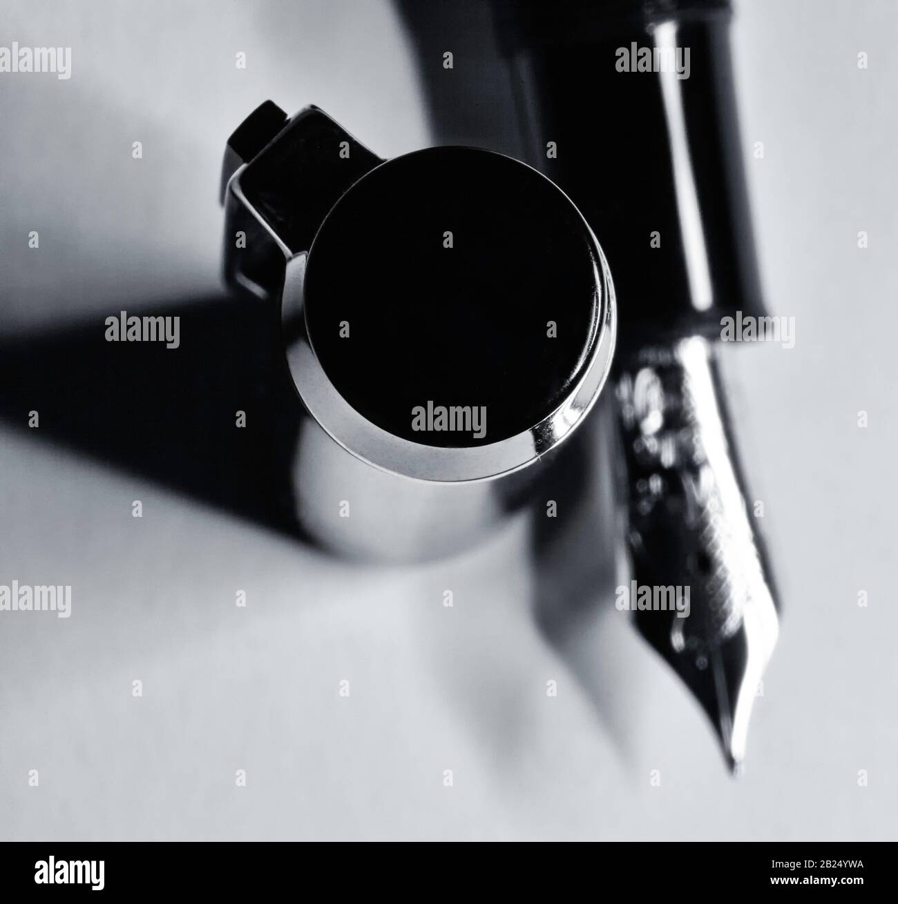 Close up of black fountain pen cap and nib. Black and white Stock Photo ...