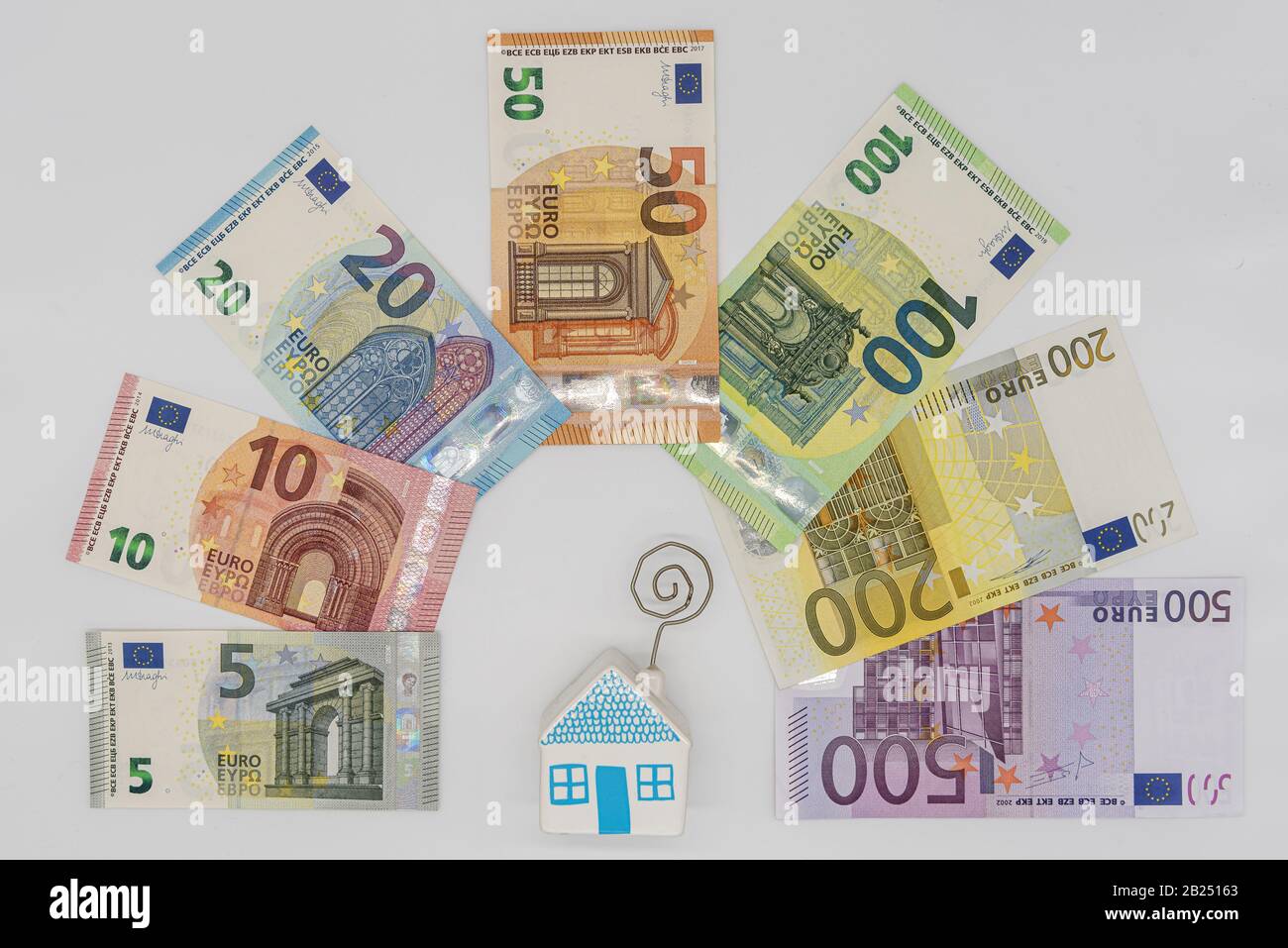 Every kind of Euro banknote with a little model of house representing ...