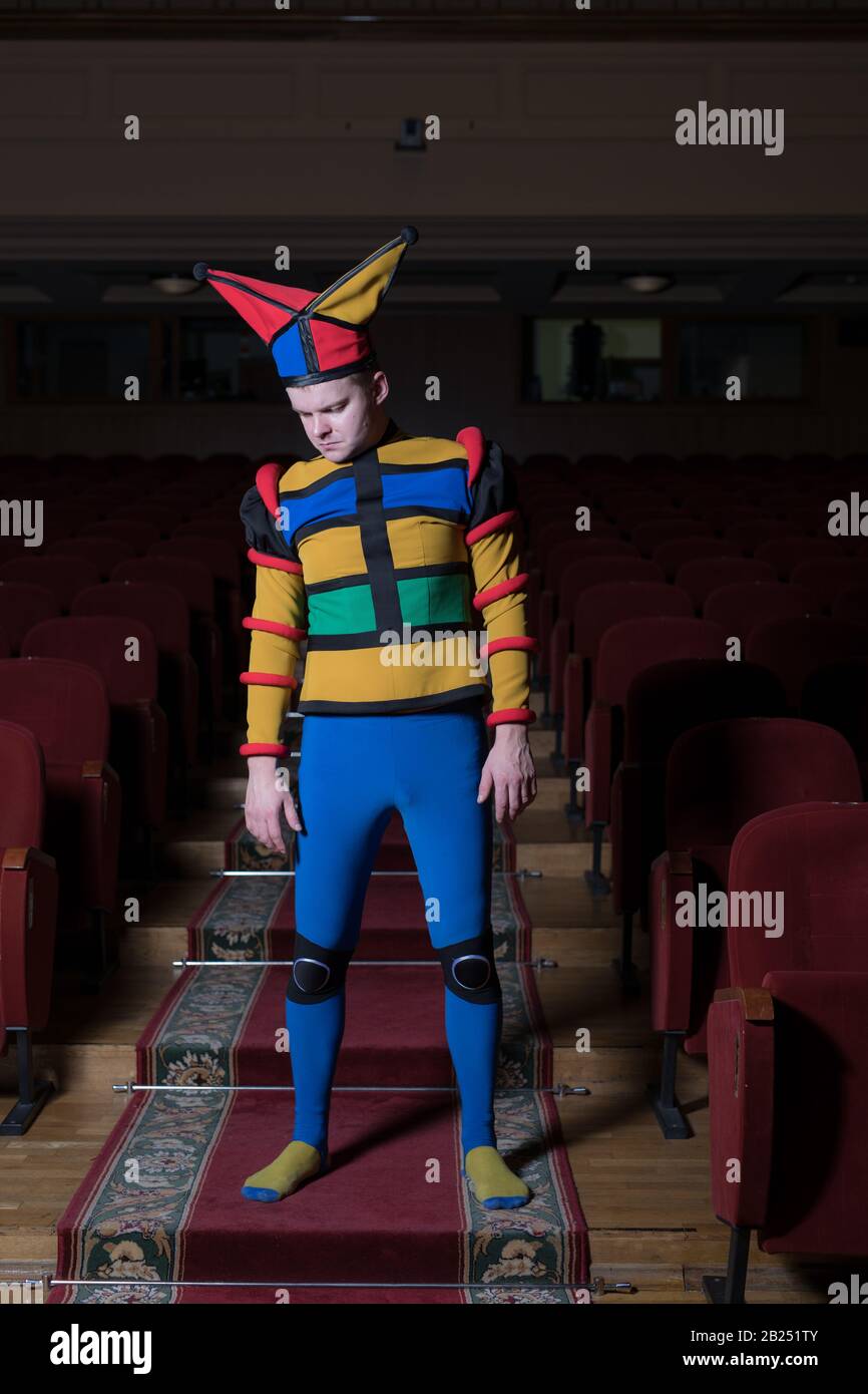 Actor dressed jester's costume in interior of old theater Stock Photo ...
