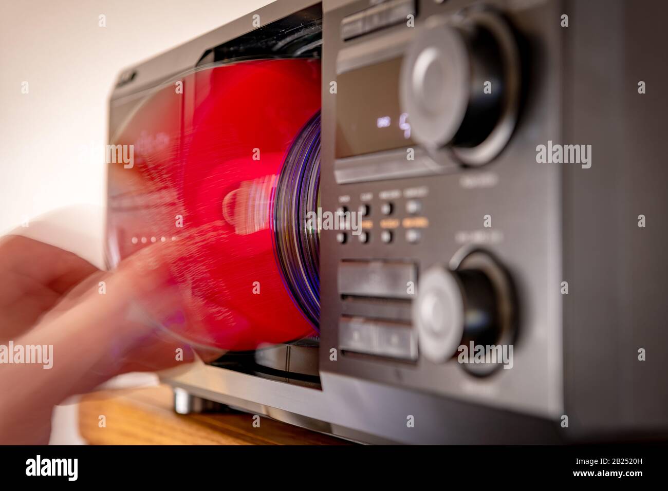 Motion blur from a CD being inserted into a player Stock Photo - Alamy