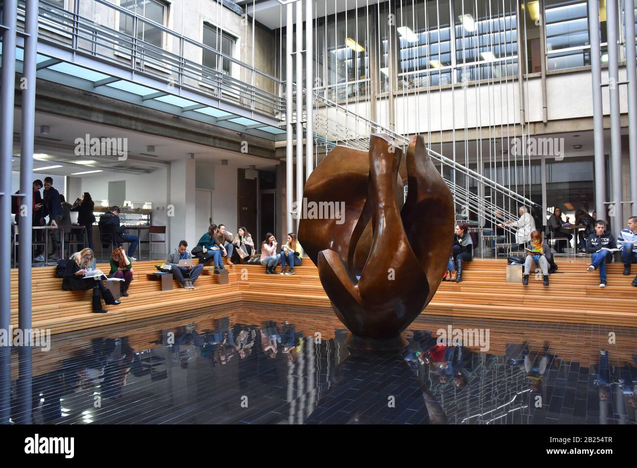 Students sit on the steps and read at the National Library Stock Photo ...