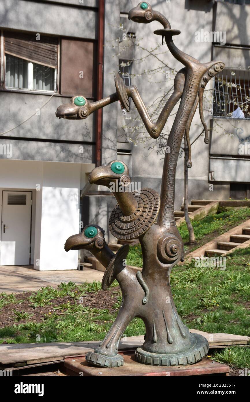 A snake sculpture in front of an apartment building Stock Photo - Alamy