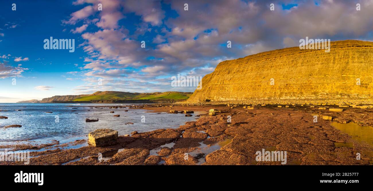 Deep blue skies are contrasted against the golden cliffs of the ...