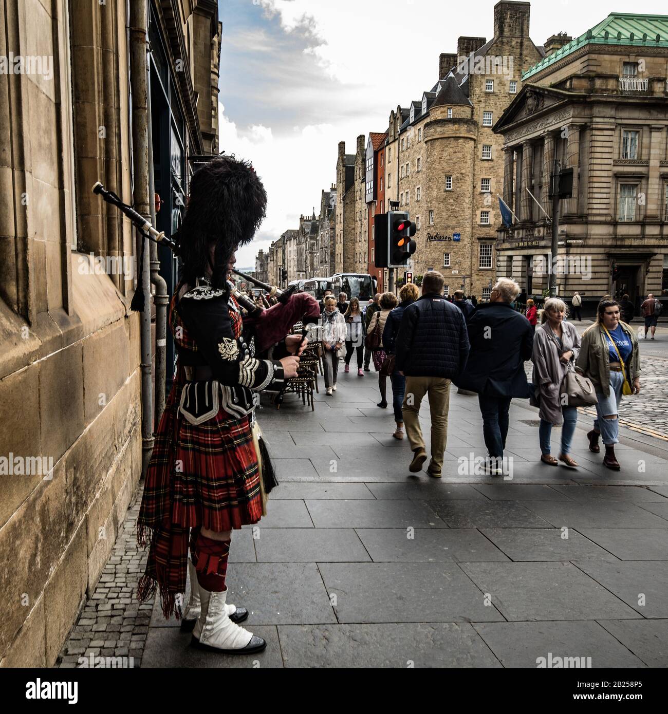 SCOTLAND, UNITED KINGDOM - MAY 30, 2019: Scottish piper in traditional ...