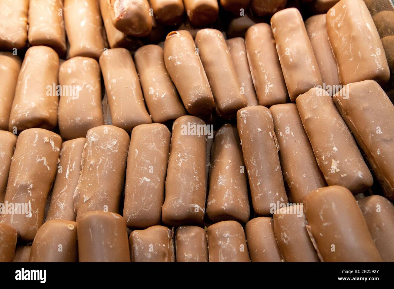 Chocolate covered with cotton candy close-up. Photographed on the ...