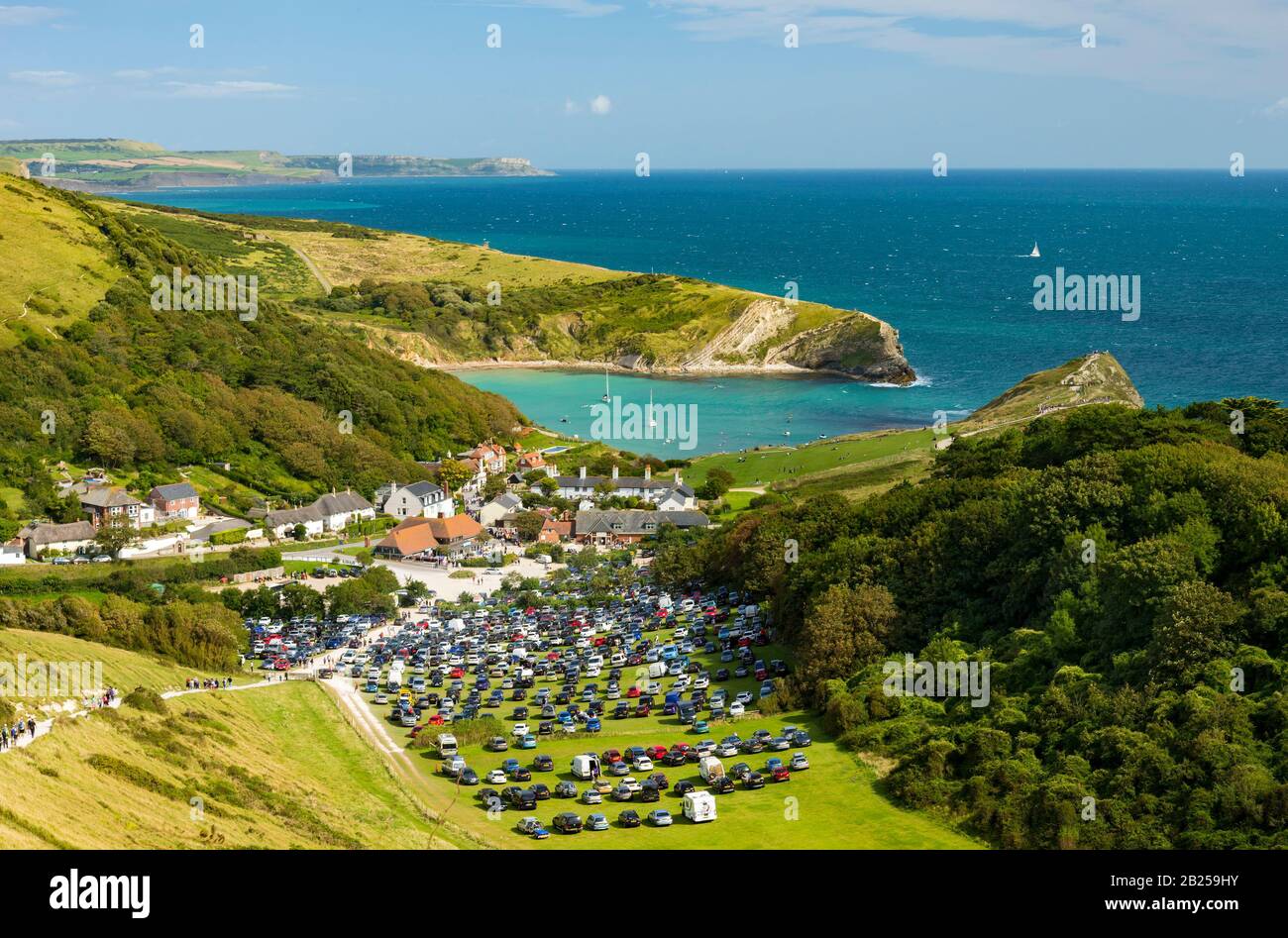 Deep blue and green water of the cove at Lulworth Stock Photo - Alamy