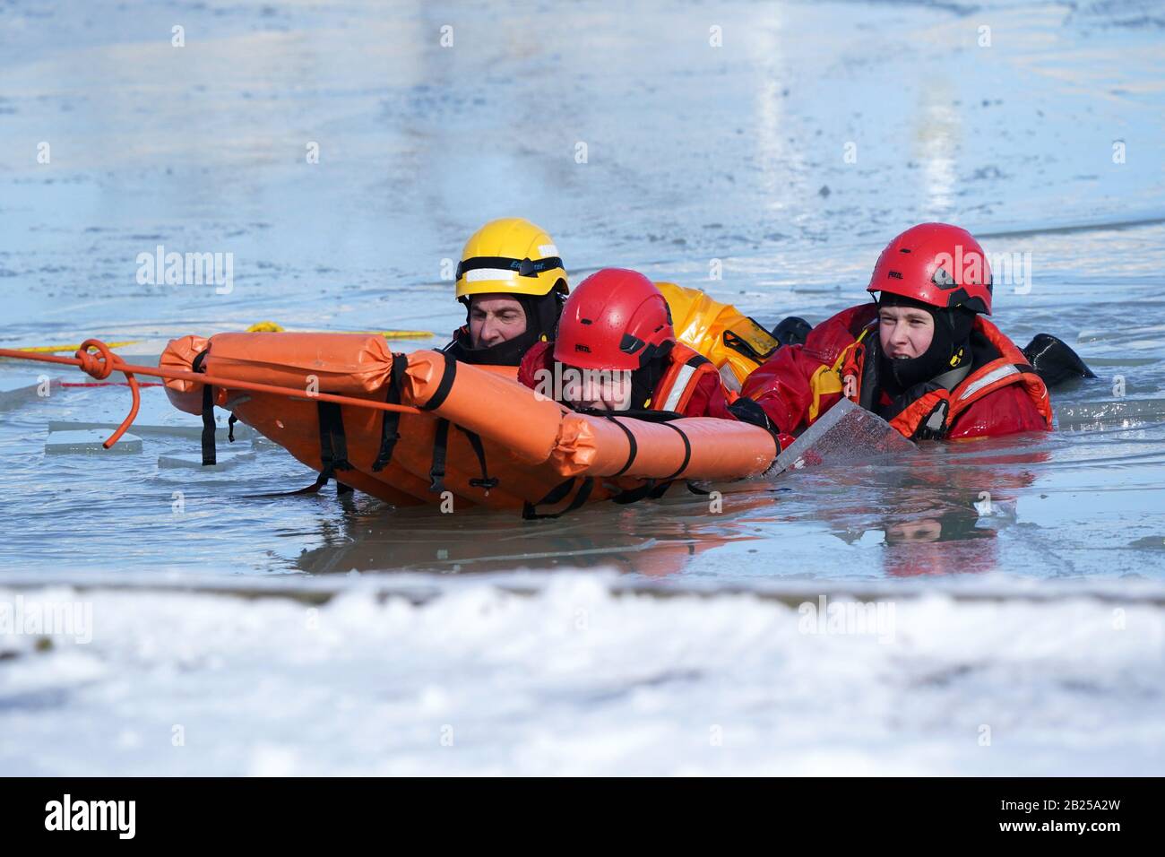 EMTs training for cold water rescue Stock Photo - Alamy