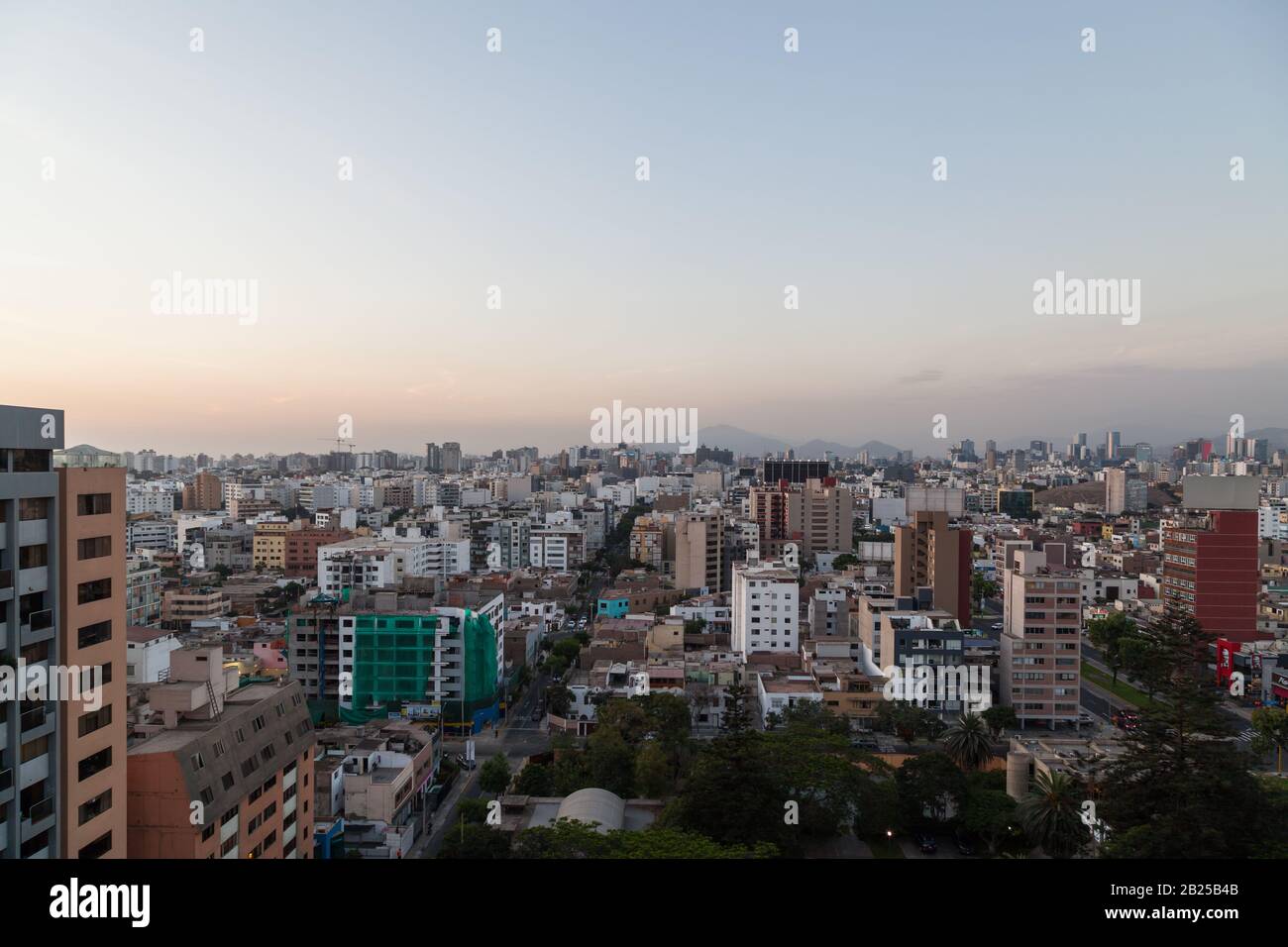 LIMA / PERU - May 10 2016: A rooftop view of the skyscrapers and sunset ...