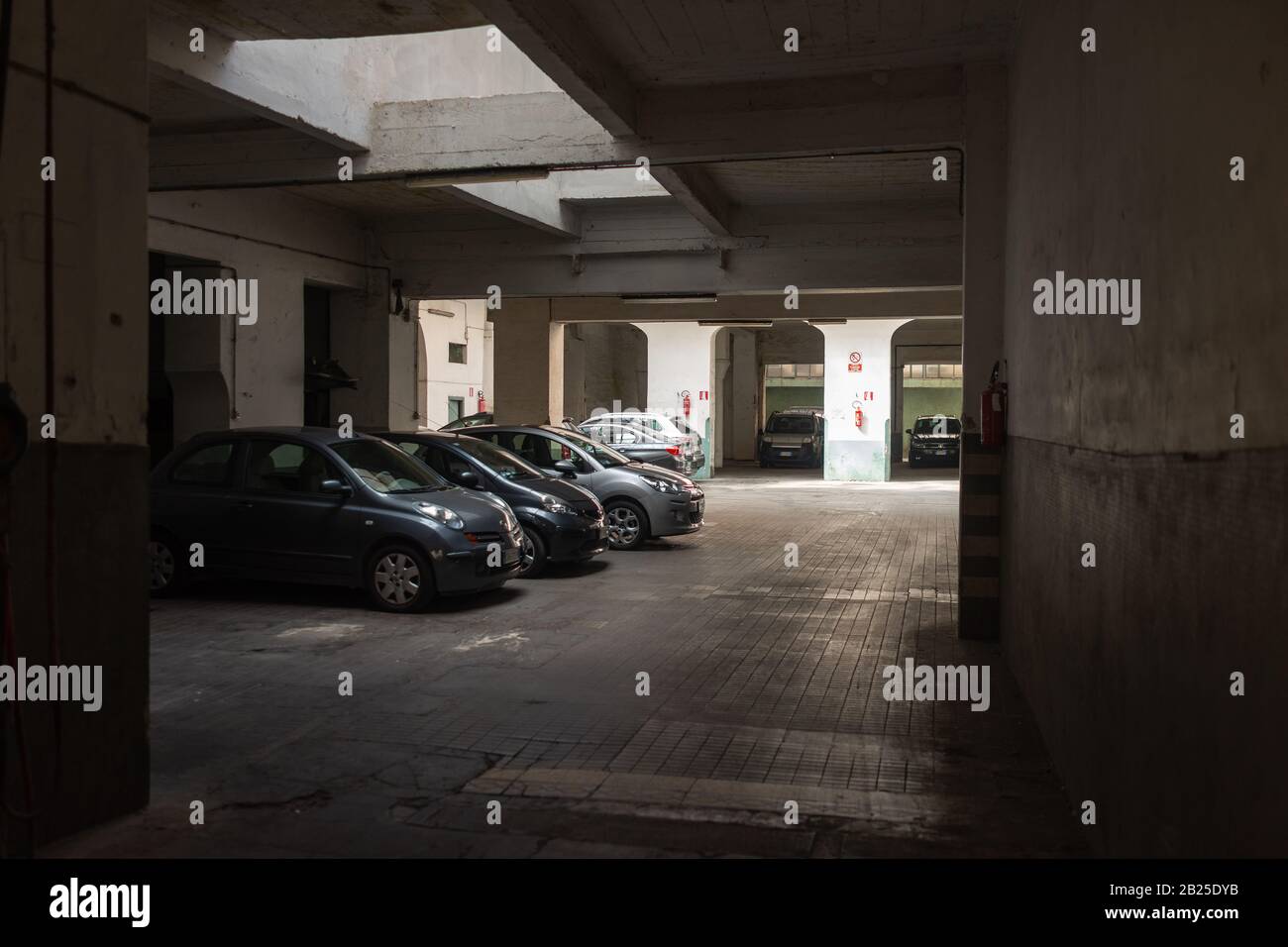 Underground parking garage in Rome Stock Photo - Alamy