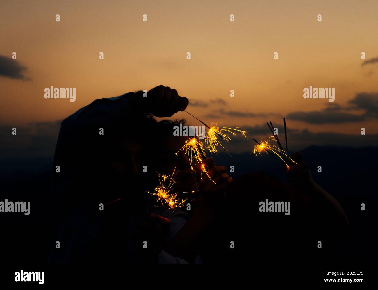 Bengal fire sticks, sparkling, burning, elegant classy ladie and ...