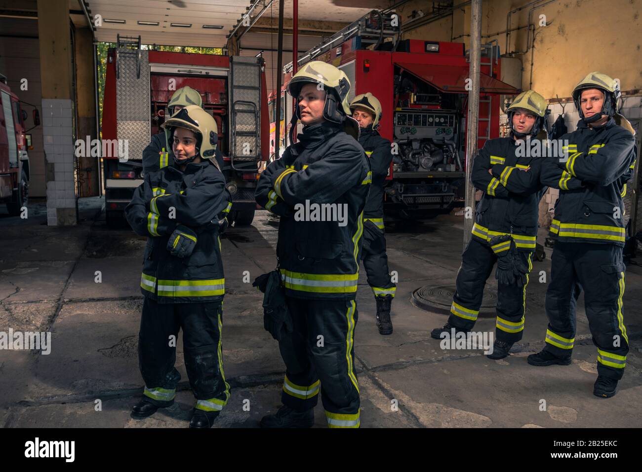 Group of firefighters standing confident with arms crossed. Firemen ...