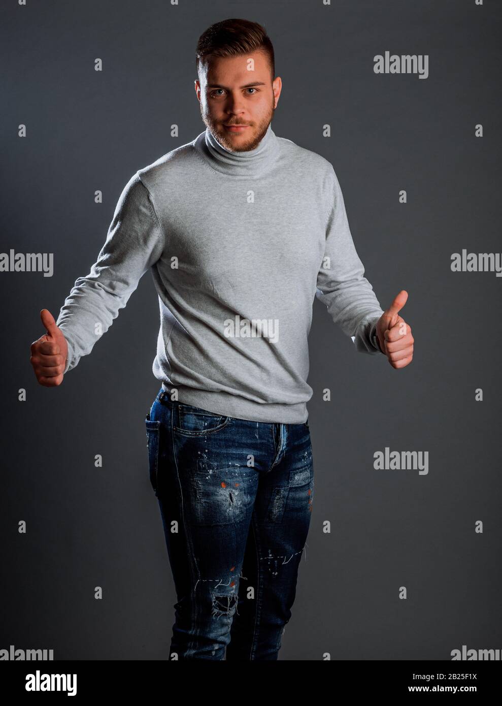 Portrait of a handsome male model posing in cool fashionable clothing ...