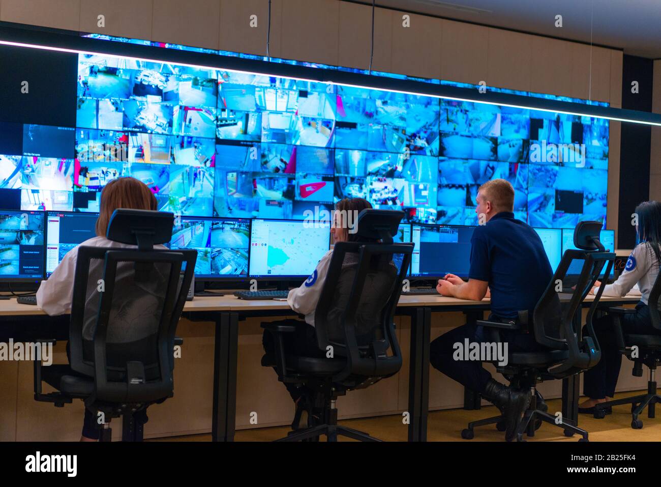 Team of secret agents in uniforms, monitoring cyber, video and ...