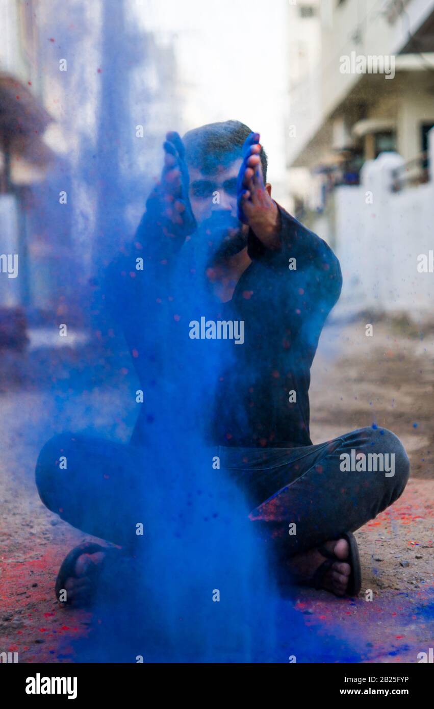 Young man in holi colors. holi is a festival of India. It is festival ...