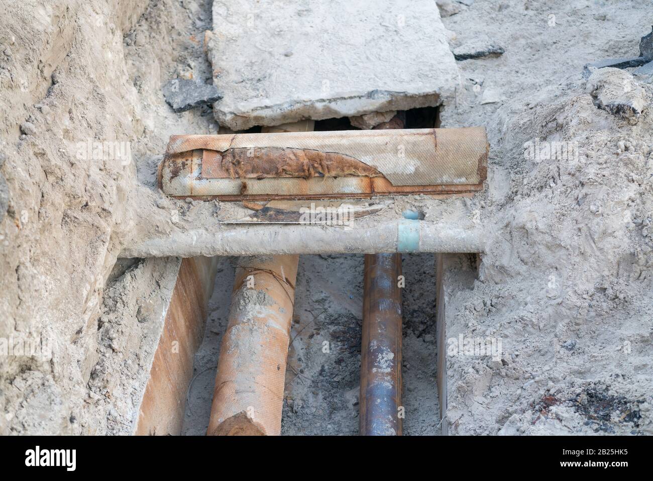 Rusty Sewer Pipes Underground. Repair of underground water supply Stock ...