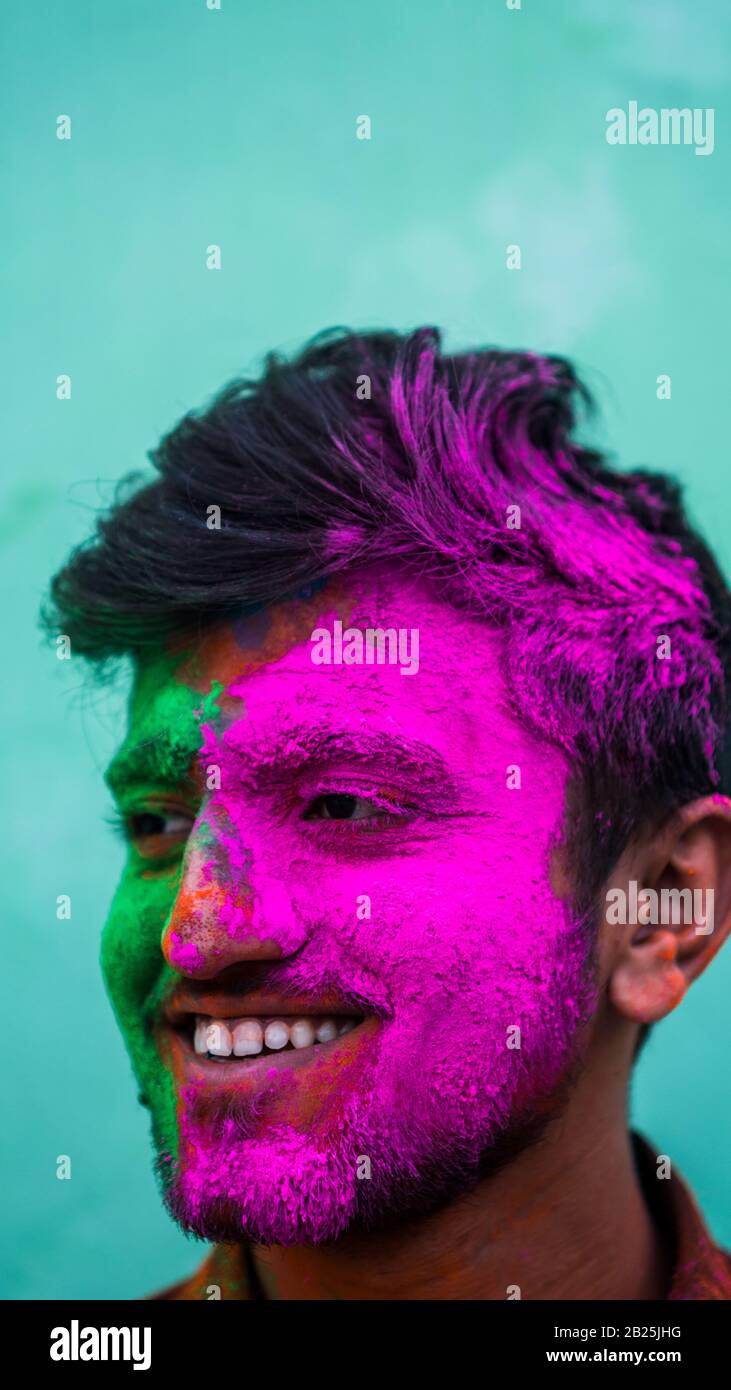 Young man in holi colors. holi is a festival of India. It is festival ...