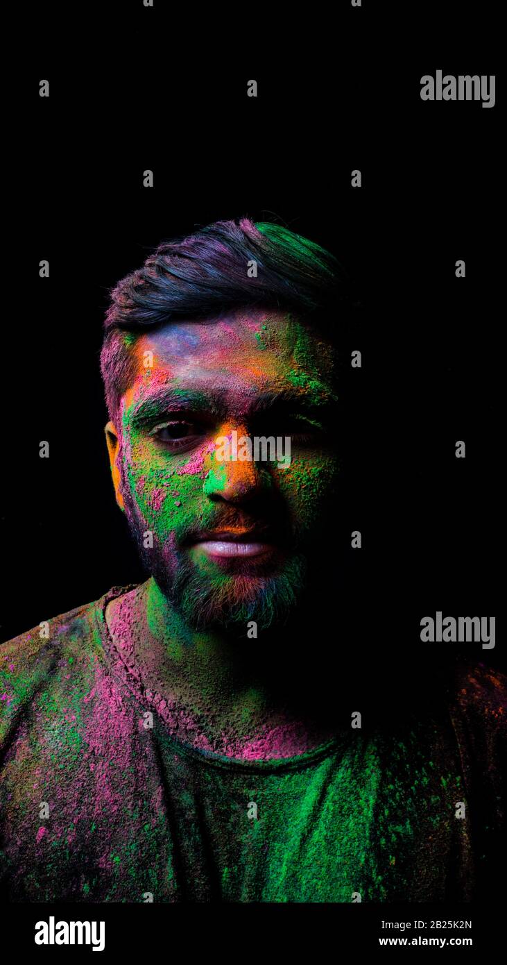 Young man in holi colors. holi is a festival of India. It is festival ...