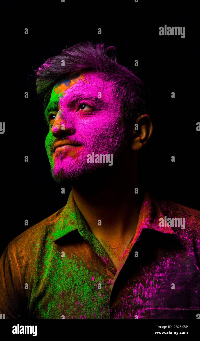 Young man in holi colors. holi is a festival of India. It is festival ...