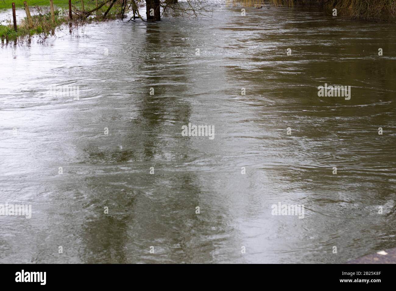 Flooded river after heavy storm rainfall flooding adjacent farmland ...