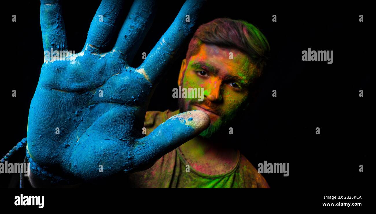 Young man in holi colors. holi is a festival of India. It is festival ...