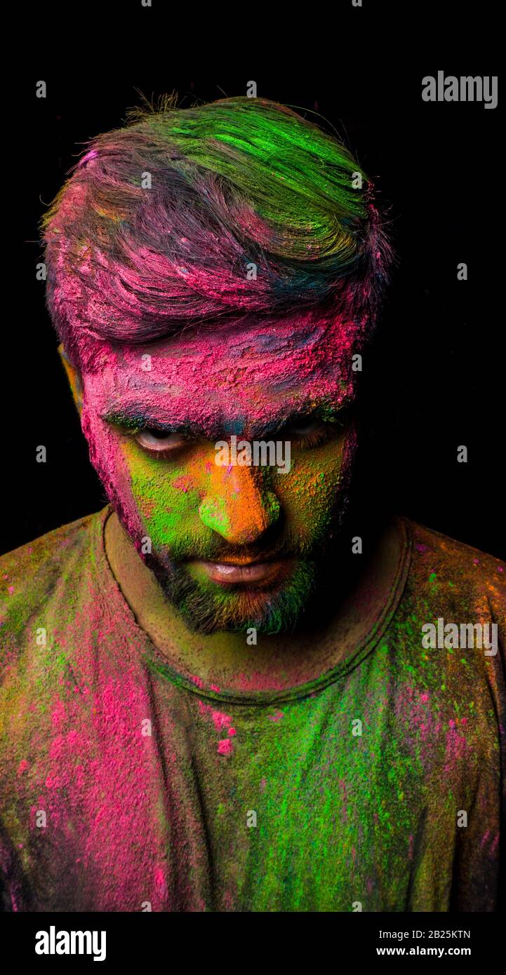 Young man in holi colors. holi is a festival of India. It is festival ...
